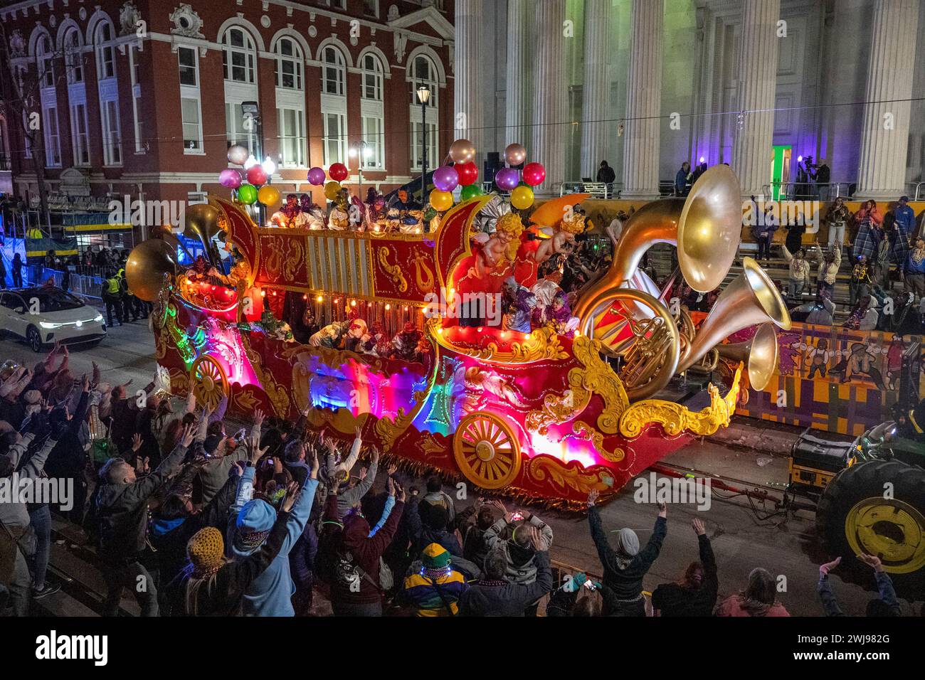 Paradegoers are seen during the Krewe of Orpheus Mardi Gras Parade in ...