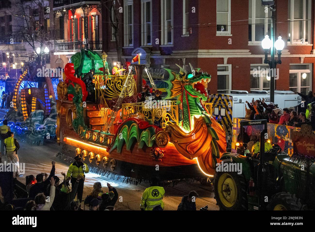 Paradegoers are seen during the Krewe of Orpheus Mardi Gras Parade in ...