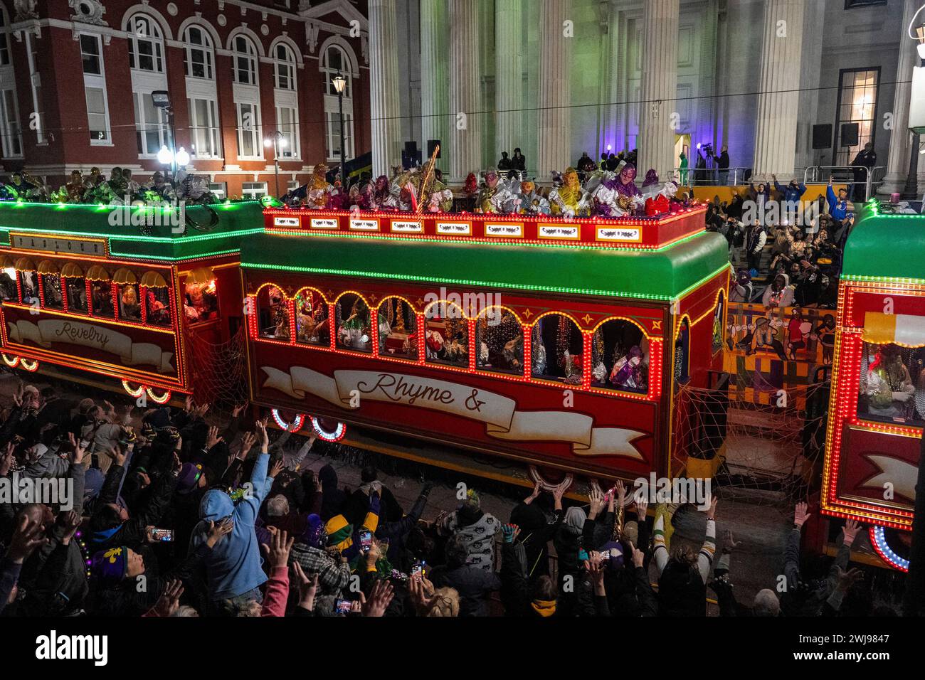 Paradegoers are seen during the Krewe of Orpheus Mardi Gras Parade in ...