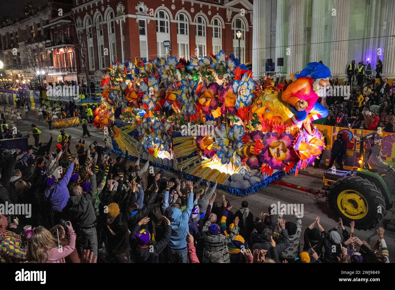 Paradegoers are seen during the Krewe of Orpheus Mardi Gras Parade in ...