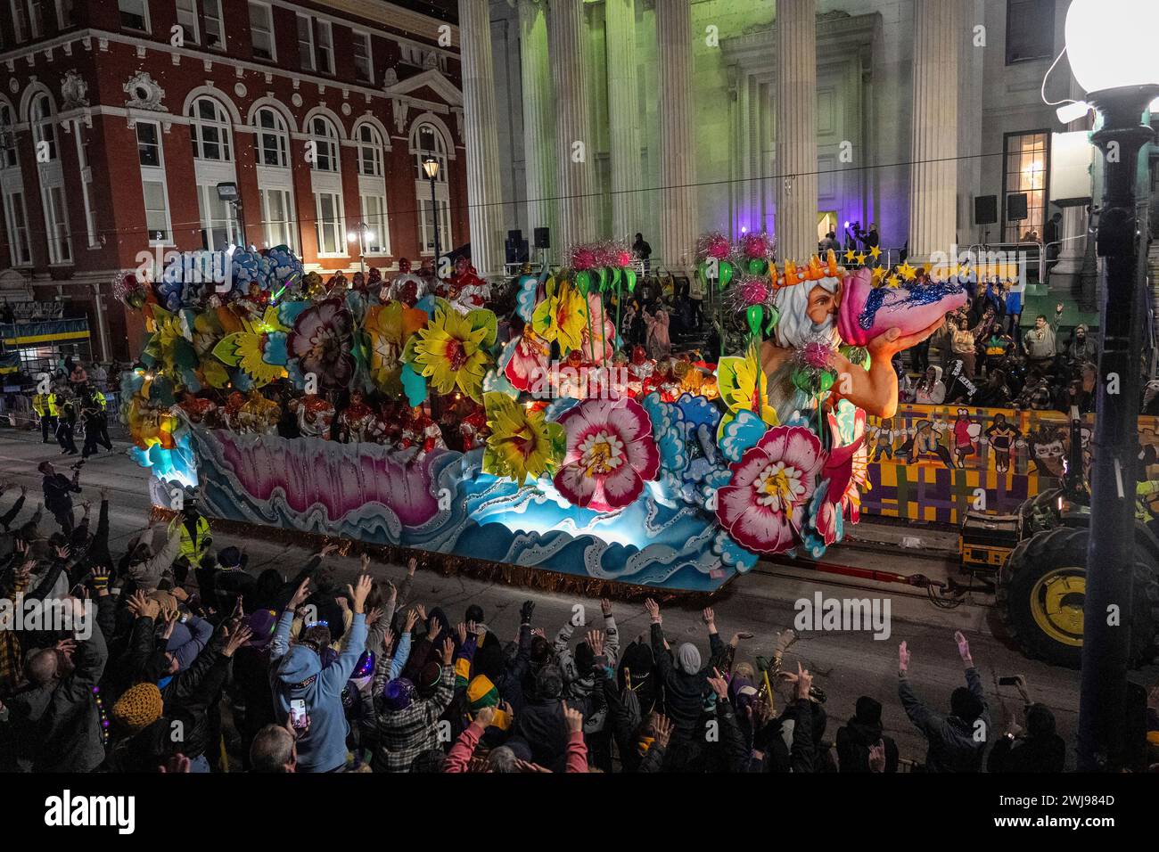 Paradegoers are seen during the Krewe of Orpheus Mardi Gras Parade in ...