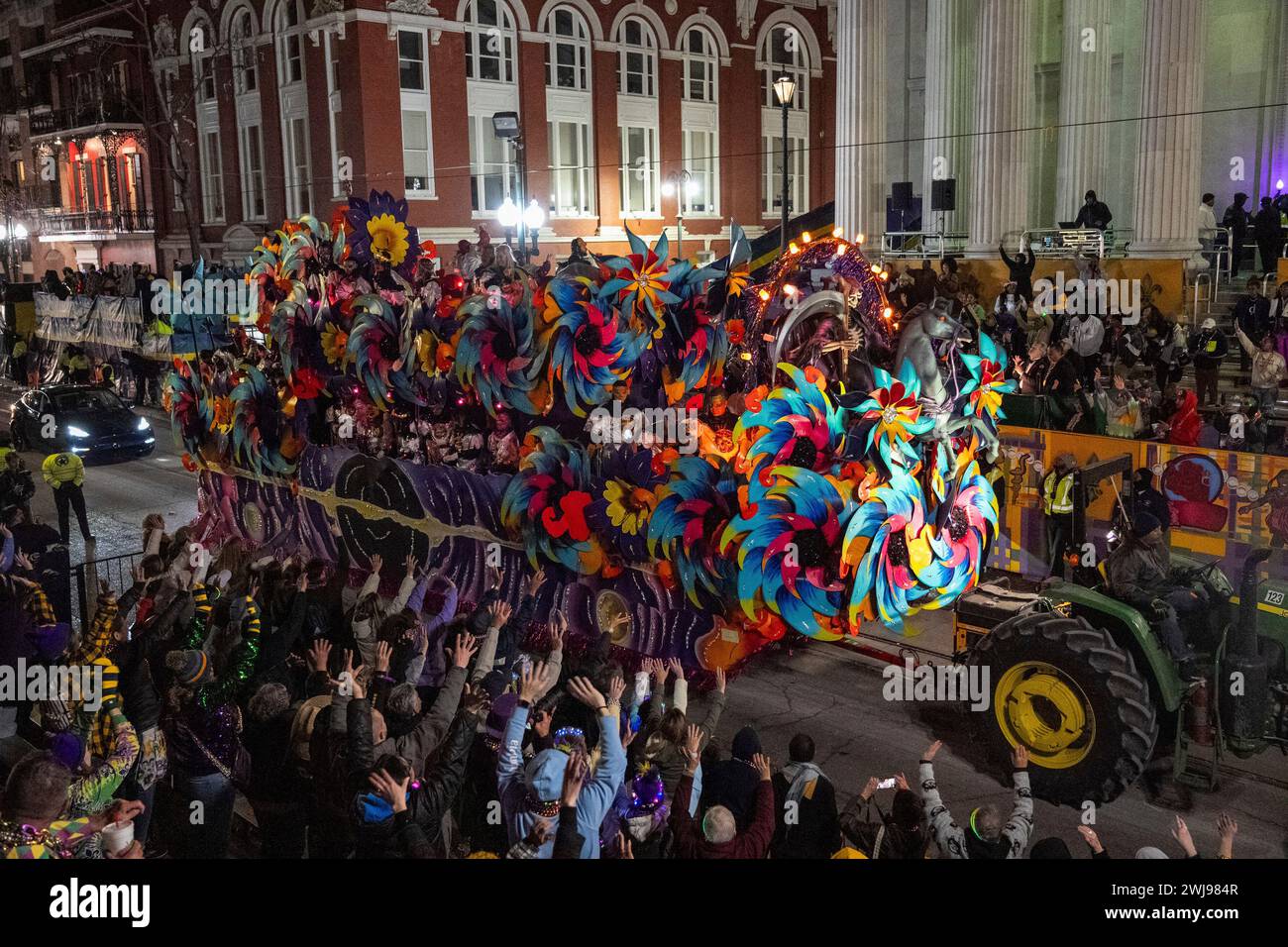 Paradegoers are seen during the Krewe of Orpheus Mardi Gras Parade in ...