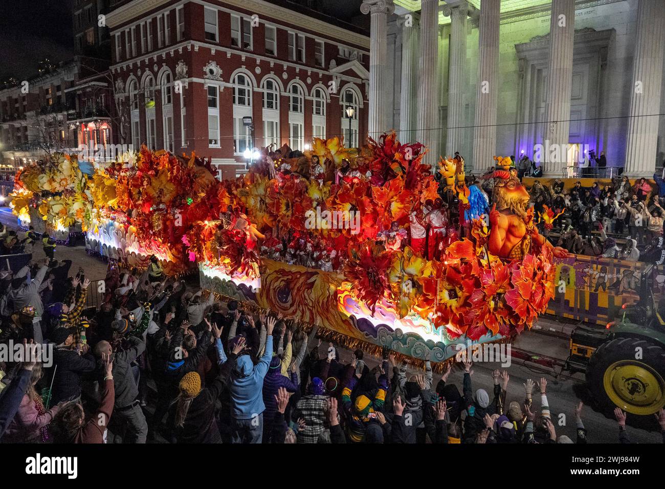 Paradegoers are seen during the Krewe of Orpheus Mardi Gras Parade in ...