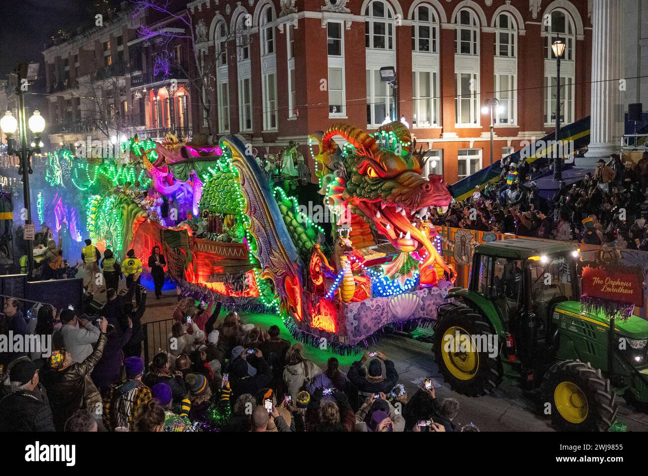 Paradegoers are seen during the Krewe of Orpheus Mardi Gras Parade in ...