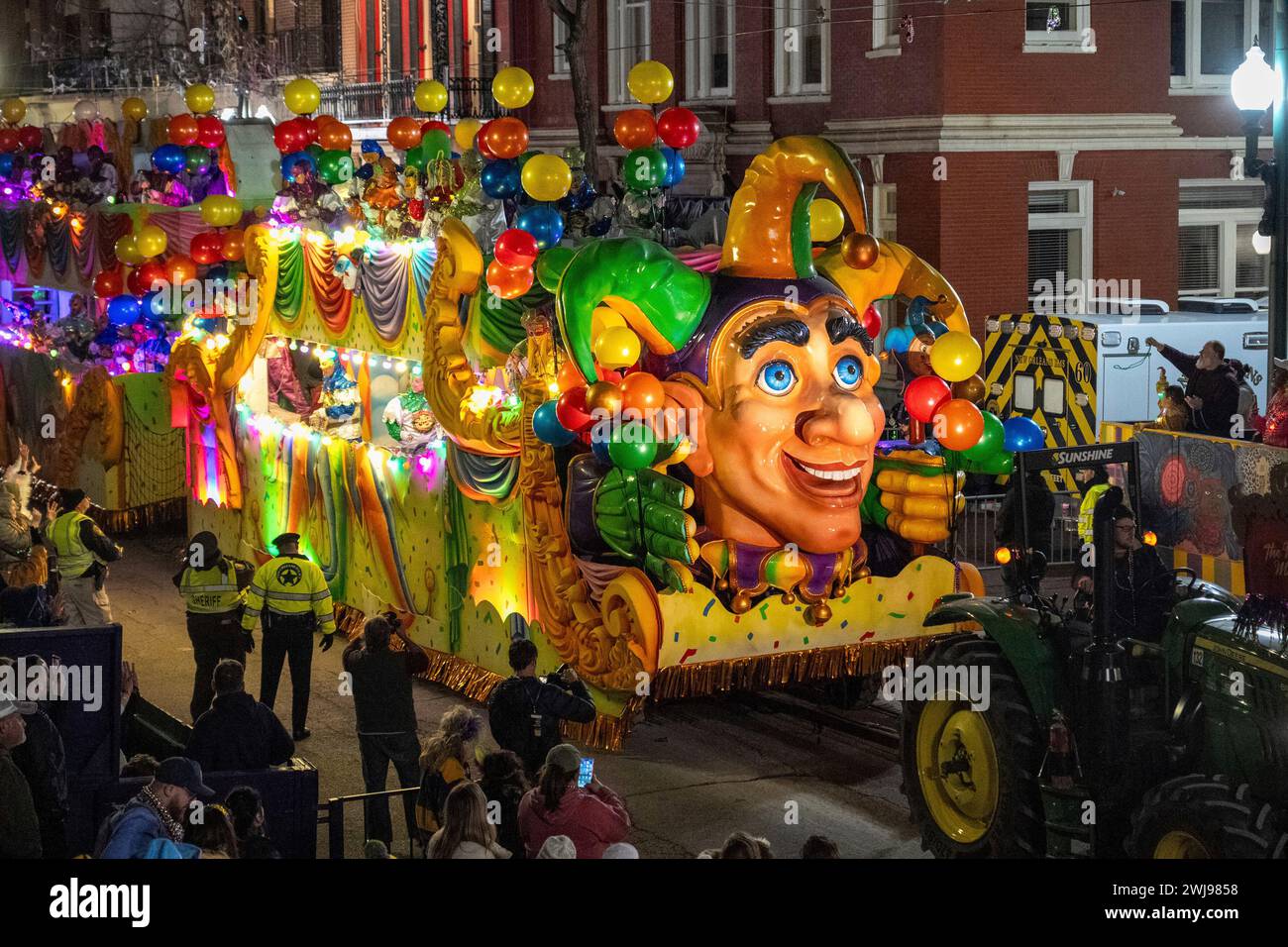 Paradegoers are seen during the Krewe of Orpheus Mardi Gras Parade in ...