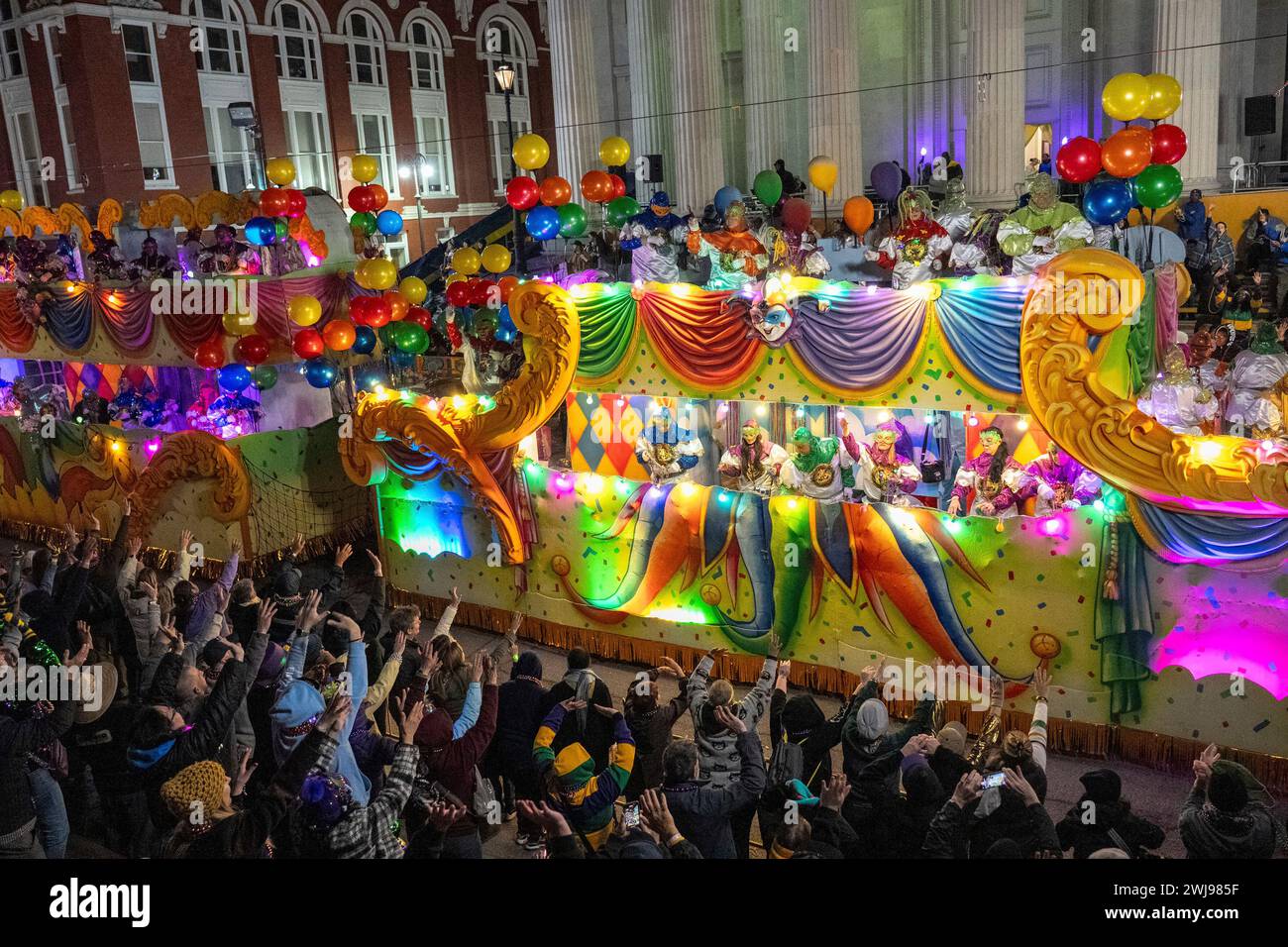 Paradegoers are seen during the Krewe of Orpheus Mardi Gras Parade in ...