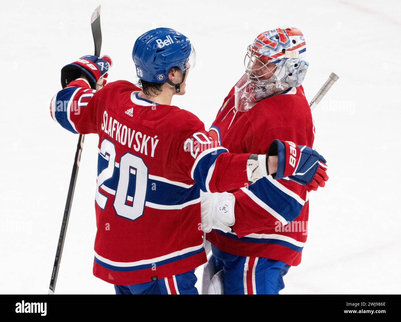 Montreal Canadiens' Juraj Slafkovsky (20) congratulates goaltender ...