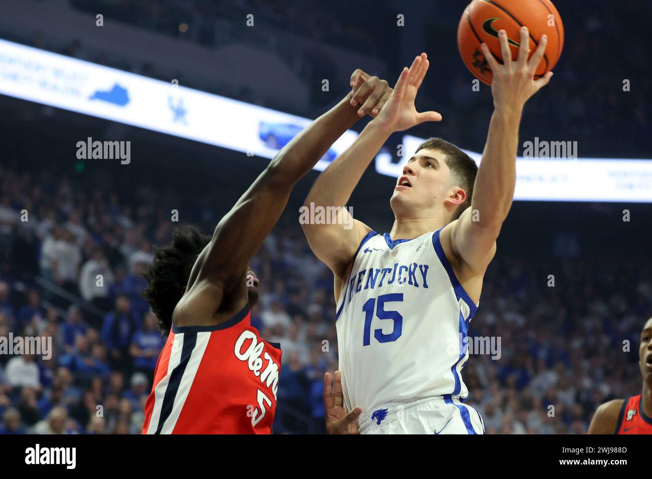 Kentucky's Reed Sheppard (15) shoots while defended by Mississippi's ...