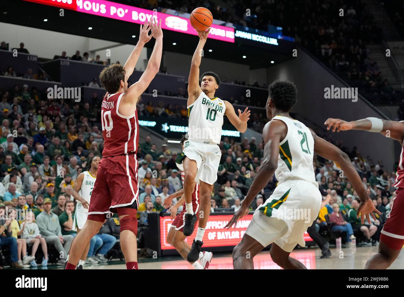 Baylor guard RayJ Dennis shoots against Oklahoma forward Sam Godwin ...