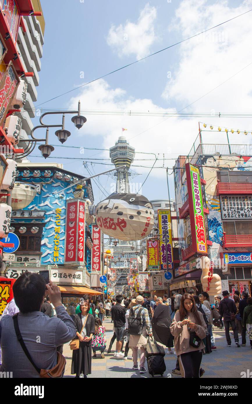 Shinseikai Food Street Signs in front of Tsutenkaku Tower, Osaka, Japan ...