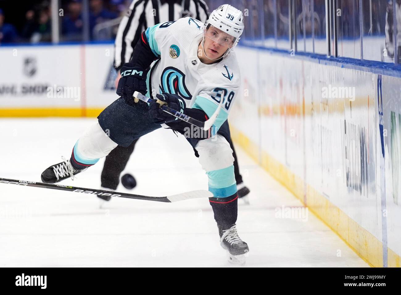 Seattle Kraken's Ryker Evans moves the puck up the ice during the third ...