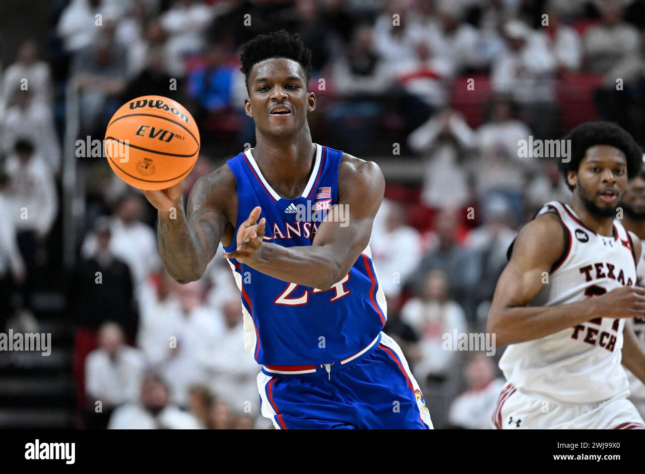 Kansas forward K.J. Adams Jr. passes the ball against Texas Tech during ...