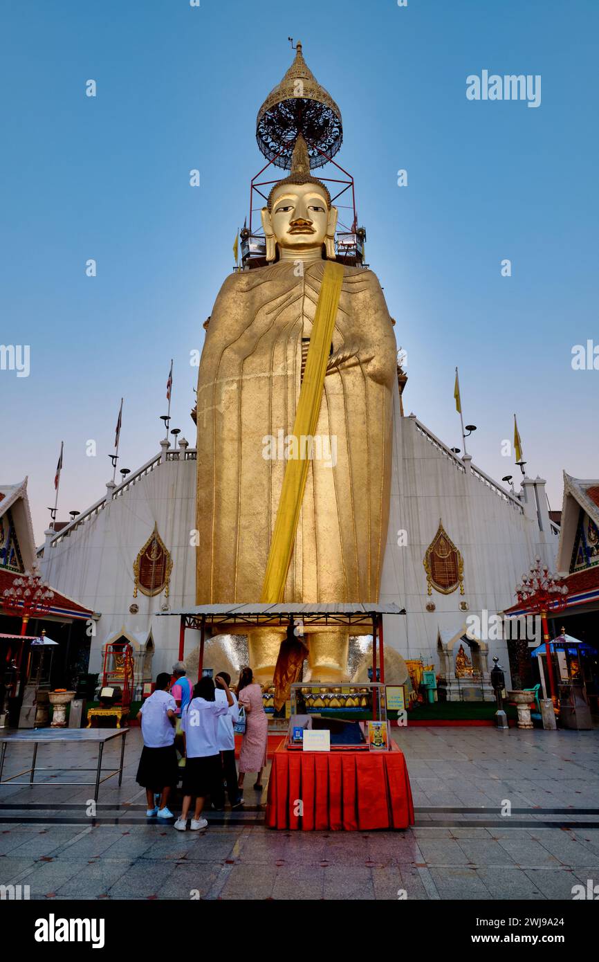 The 32 m high golden statue of a standing Buddha and a major Bangkok ...