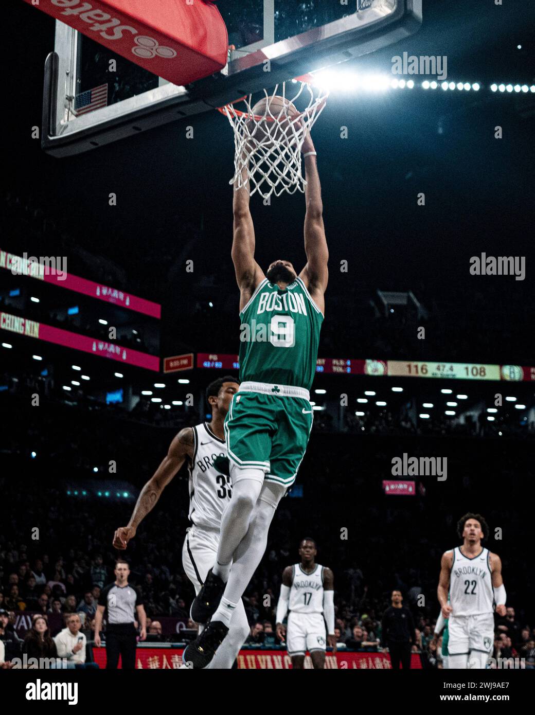 Boston Celtics guard Derrick White (9) dunks in front of Brooklyn Nets ...