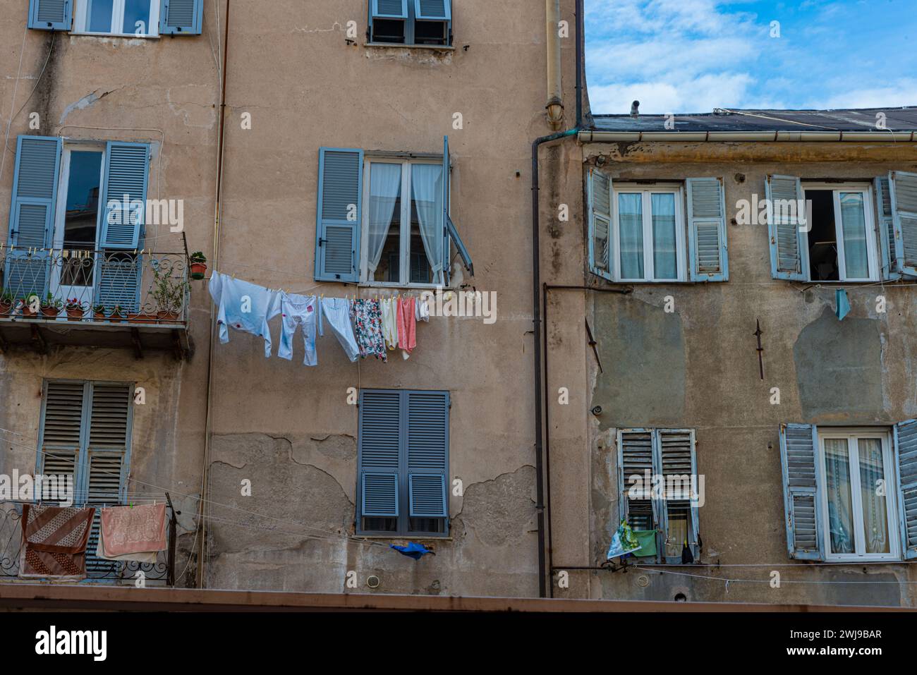 apartment building with drying laundry in Genoa, Italy Stock Photo - Alamy