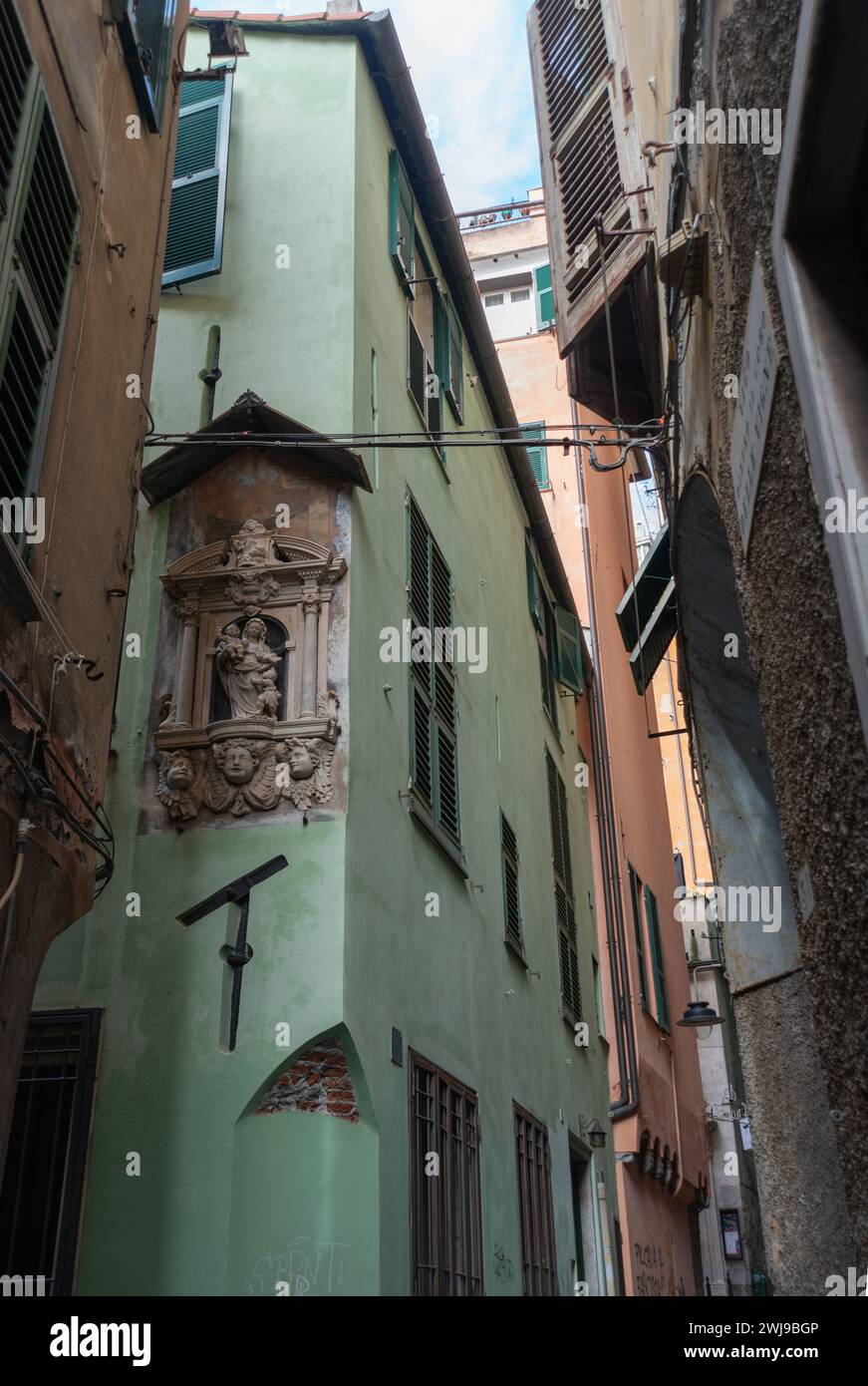Colorful buildings in Narrow space between buildings in Genoa, Italy ...