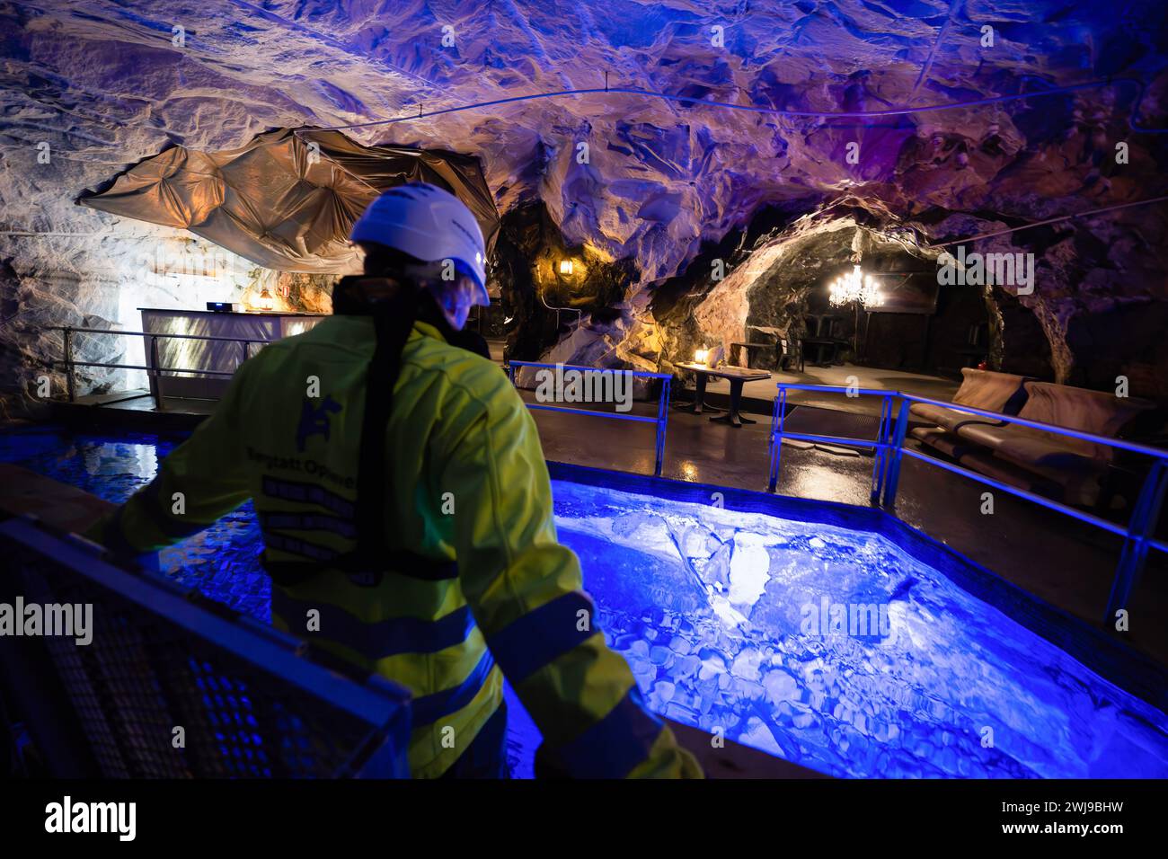A guide prepares to hook up the transport boat inside one of the docks ...