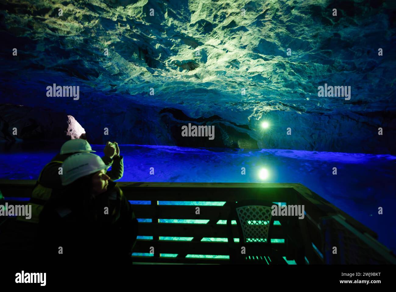 A group of visitors tours some galleries of the Bergtatt marble mine ...