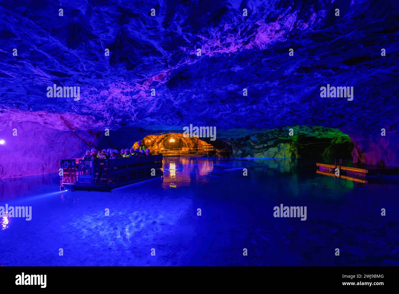 A group of visitors tours some galleries of the Bergtatt marble mine ...