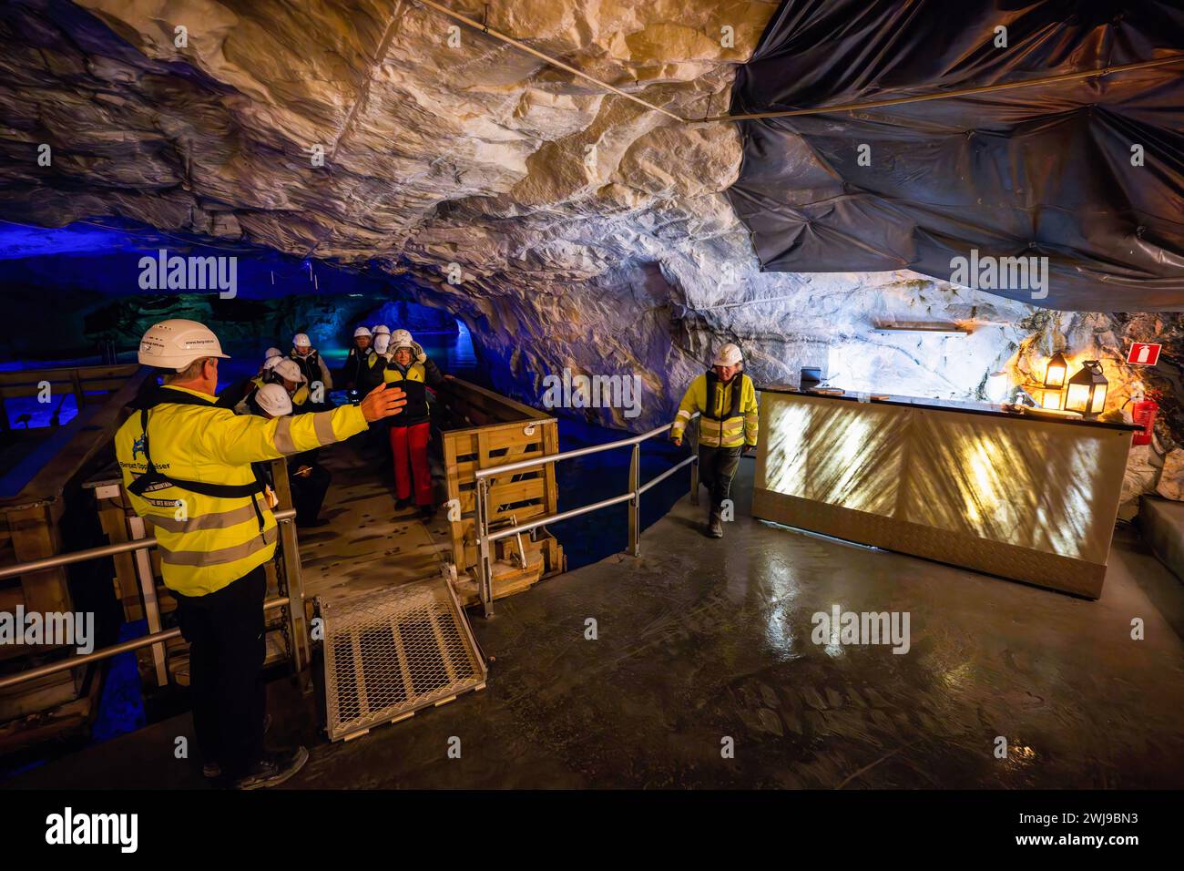 A miner helps guide visitors through one of the galleries during a ...