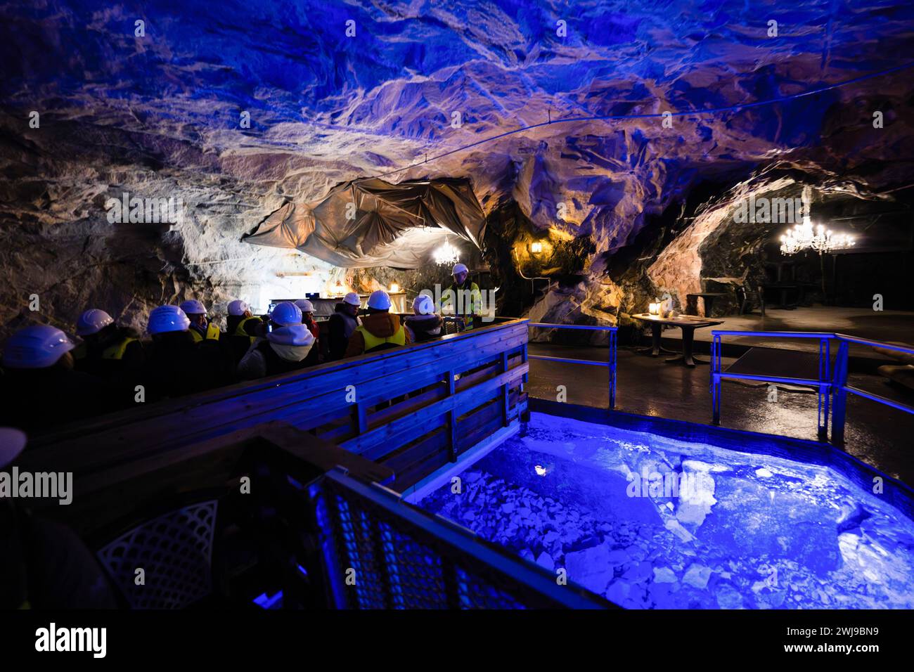 A group of visitors tours some galleries of the Bergtatt marble mine ...