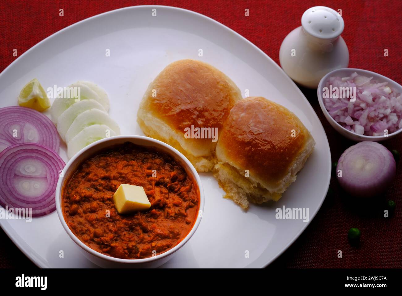 Pav Bhaji Indian spicy fast food with bread, onion and butter, Indian ...
