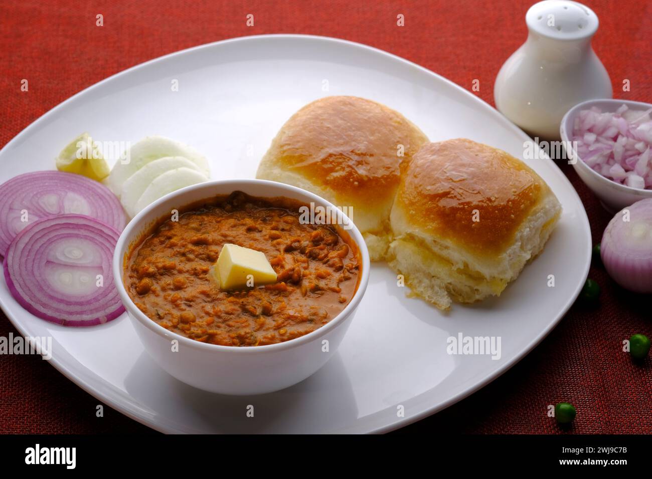 Pav Bhaji Indian spicy fast food with bread, onion and butter, Indian ...