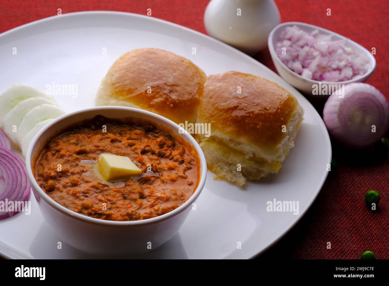 Pav Bhaji Indian spicy fast food with bread, onion and butter, Indian ...