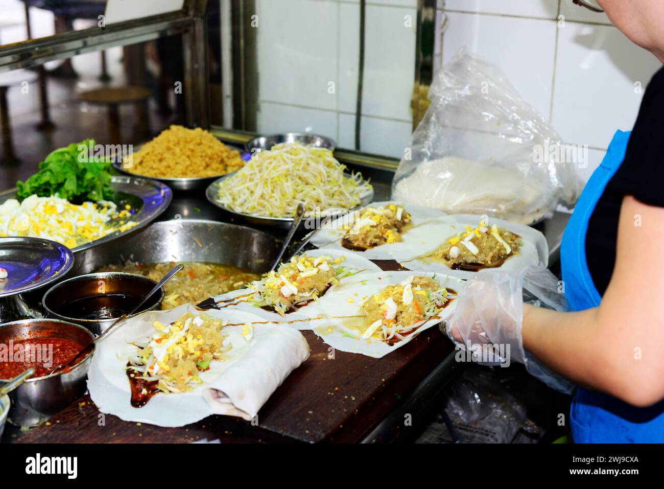 Popiah is a large spring roll popular in Singapore Stock Photo - Alamy