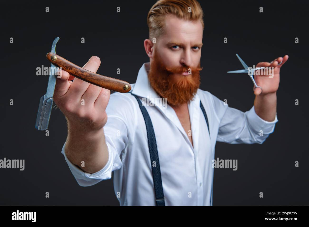 Hairdressing skills of man. Retro hairdresser holding razor and ...