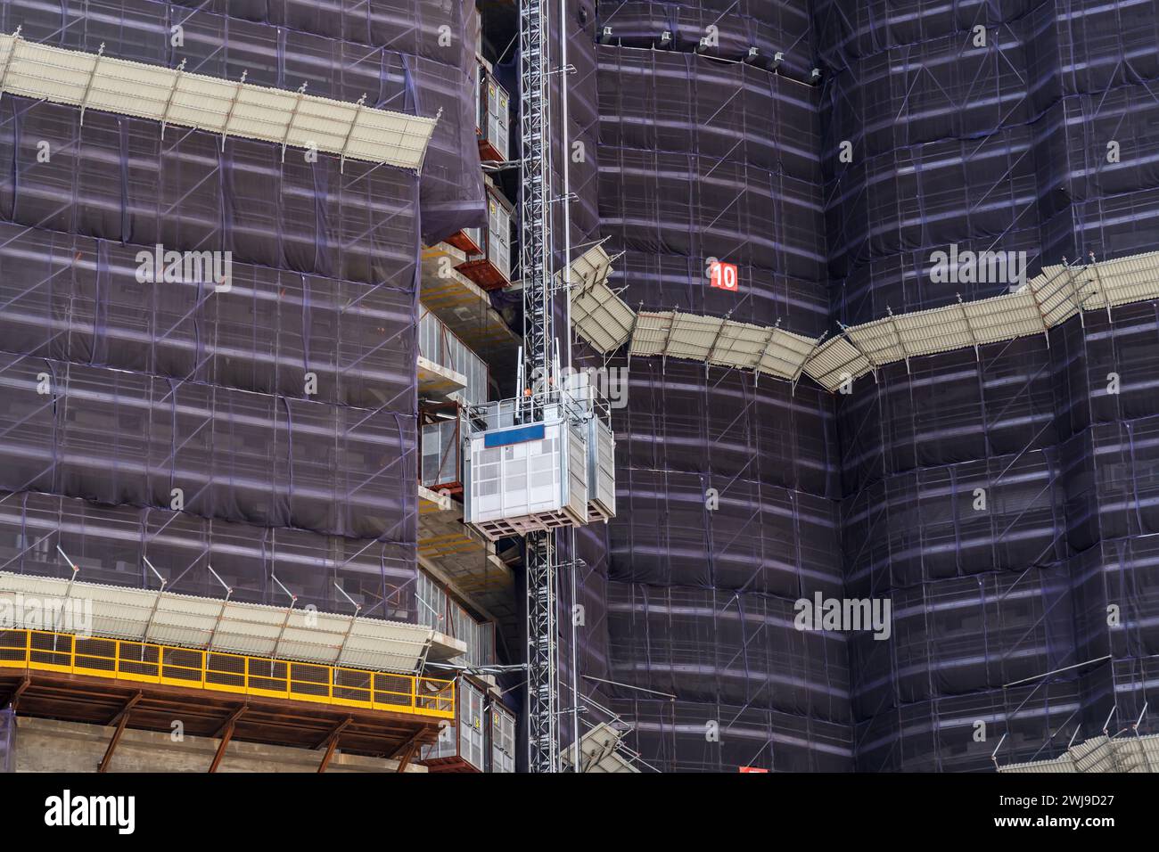 View looking up at a building under construction made of concrete ...