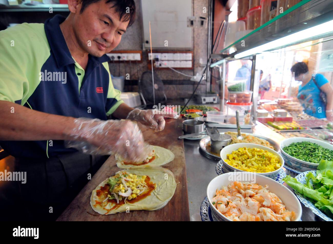 Popiah is a large spring roll popular in Singapore Stock Photo - Alamy