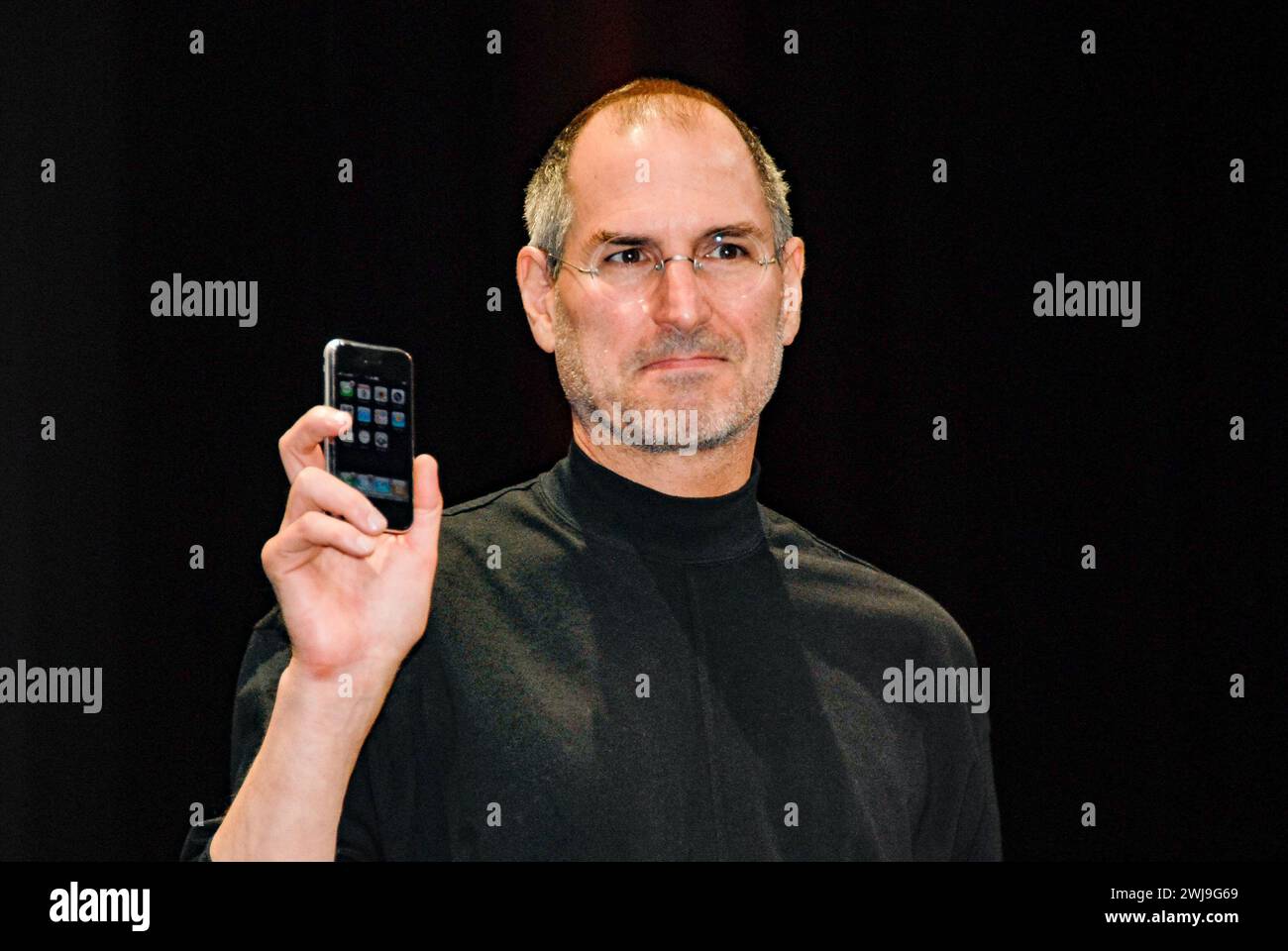 Apple's chief executive officer Steve Jobs unveils a new mobile phone ...