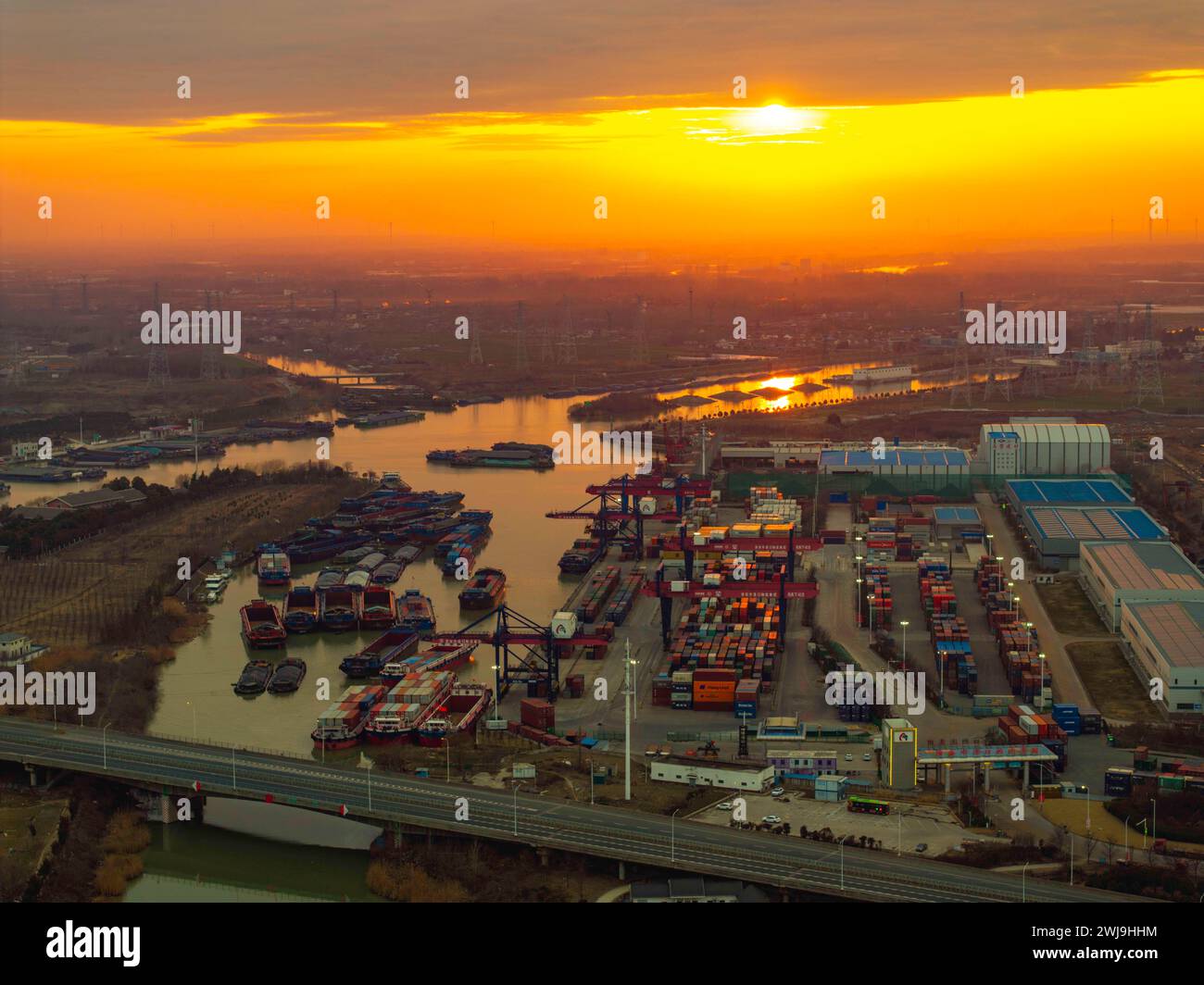 HUAI'AN, CHINA - FEBRUARY 13, 2024 - Trucks lift and carry cargo ...