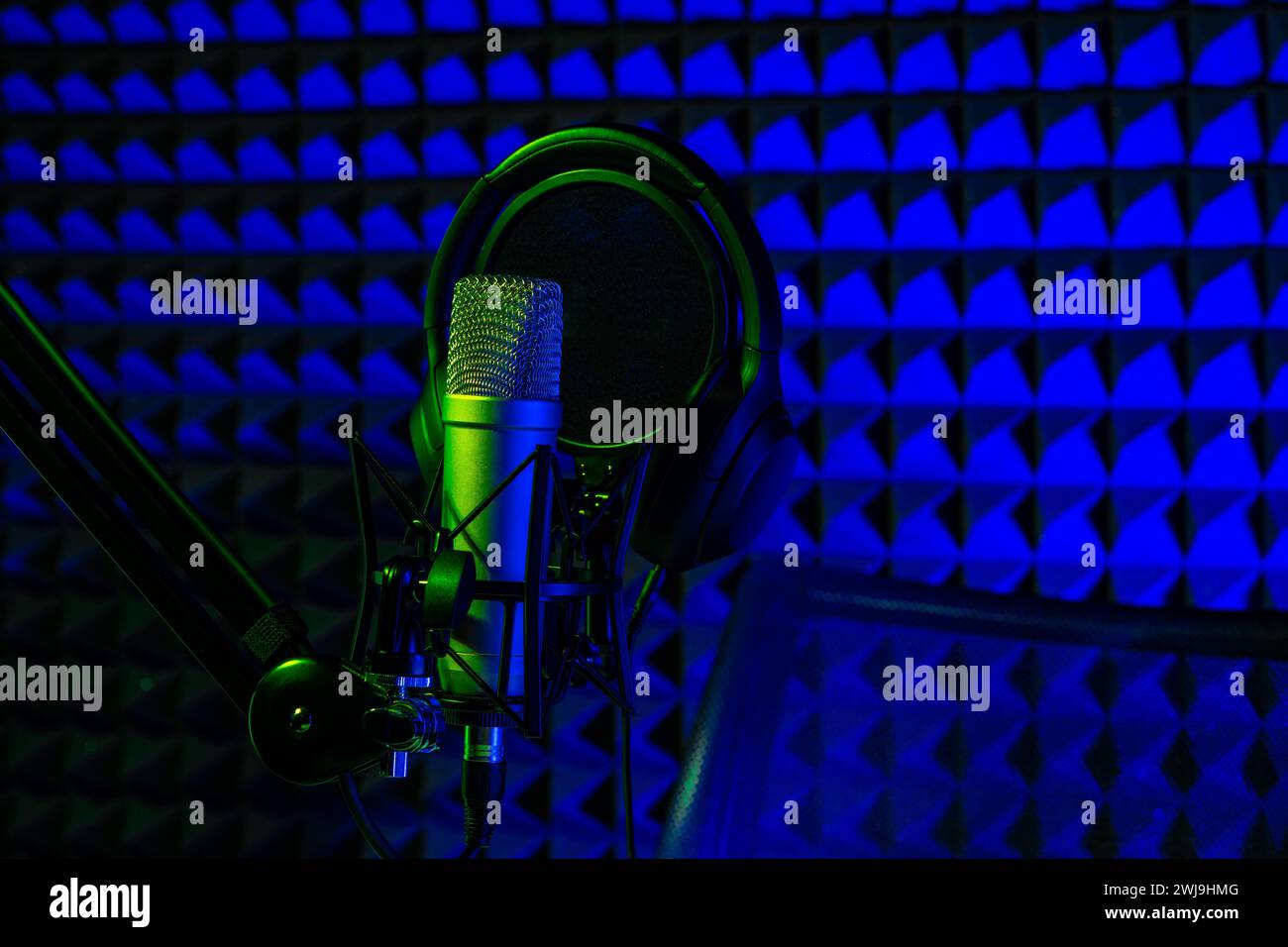 Professional microphone in a recording studio in blue light Stock Photo ...