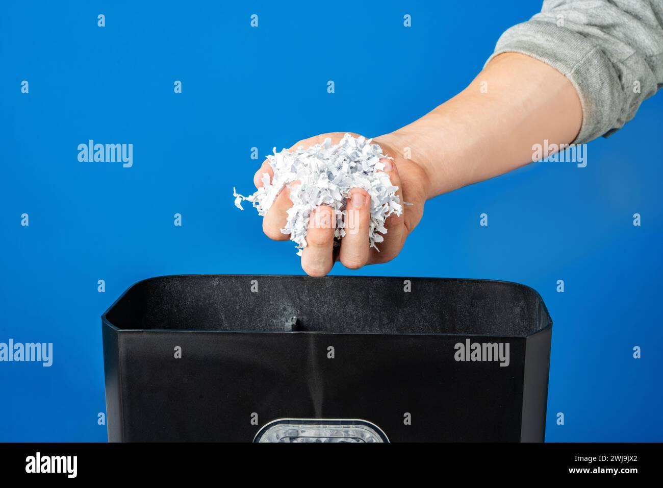 Male hand holding a bunch of shredded paper Stock Photo - Alamy Male hand holding a bunch of shredded paper Stock Photo - Alamy