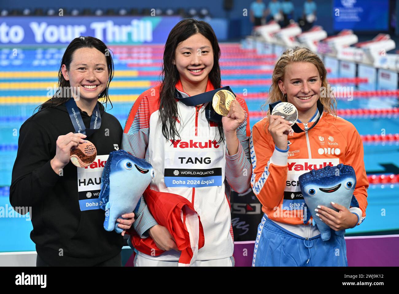 Doha, Qatar. 13th Feb, 2024. Gold medalist Tang Qianting (C) of China ...
