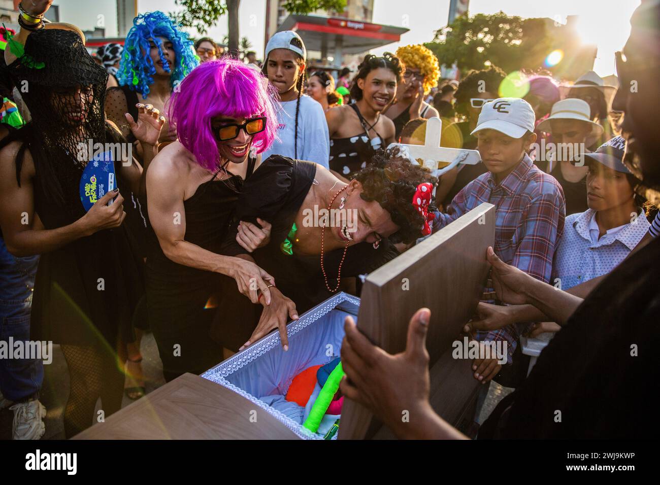 A group of LGBTQ persons dressed as the widows of Joselito are crying ...