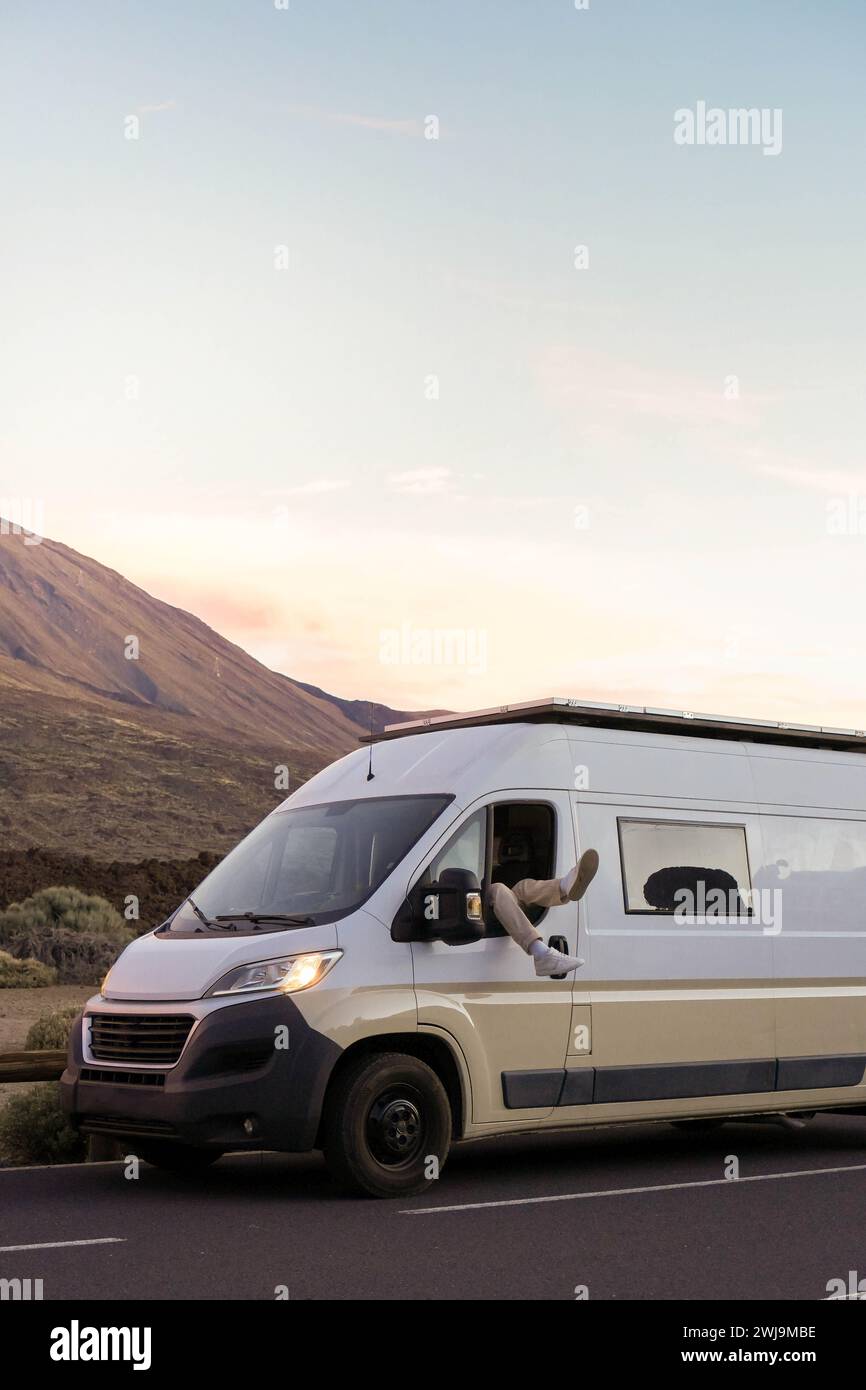 A white van is captured in a moment of tranquility as it is parked by ...