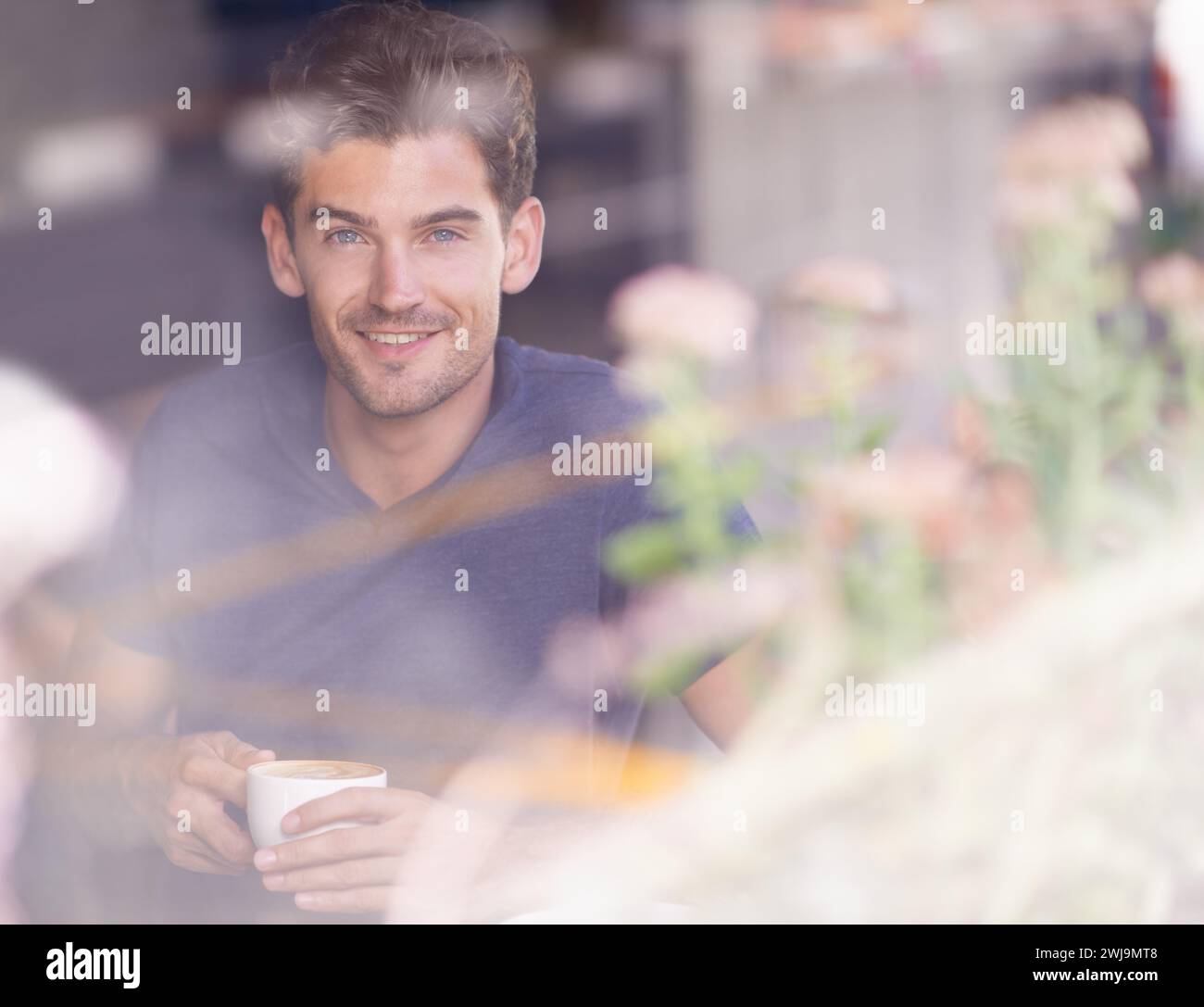 Man, portrait and drinking tea in coffee shop, window and hot beverage ...