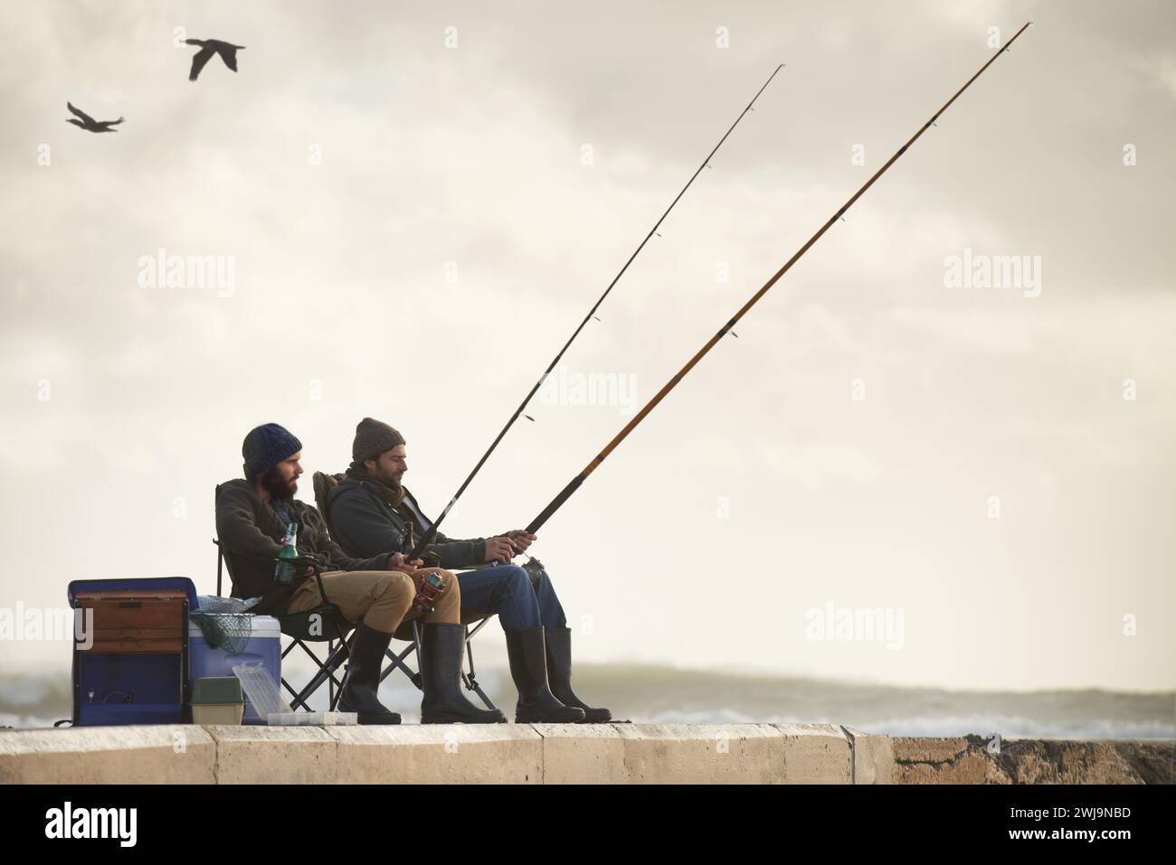 Man relaxing in chair fishing hi-res stock photography and images - Alamy