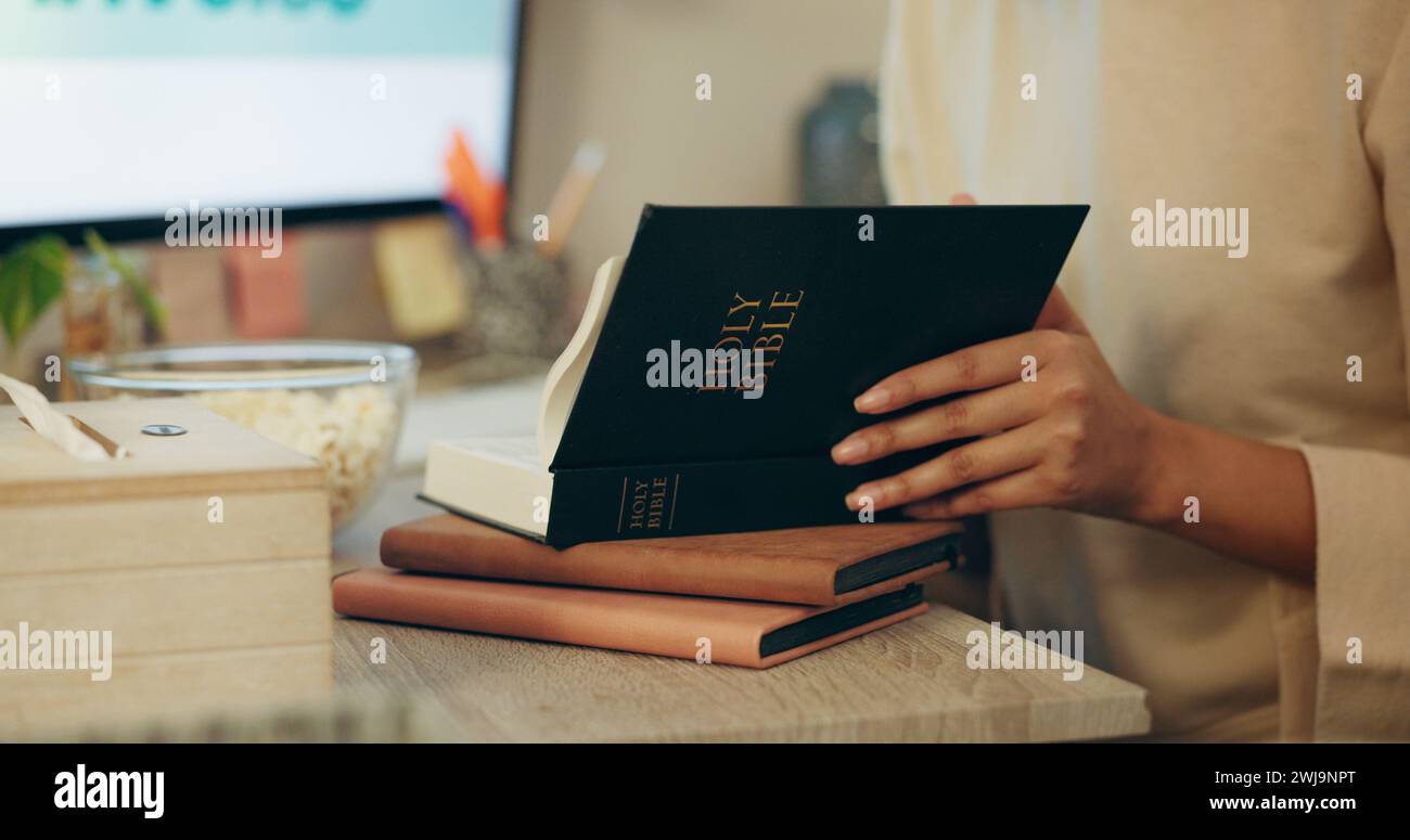 Bible, religion and hands of person reading holy Christian book to ...