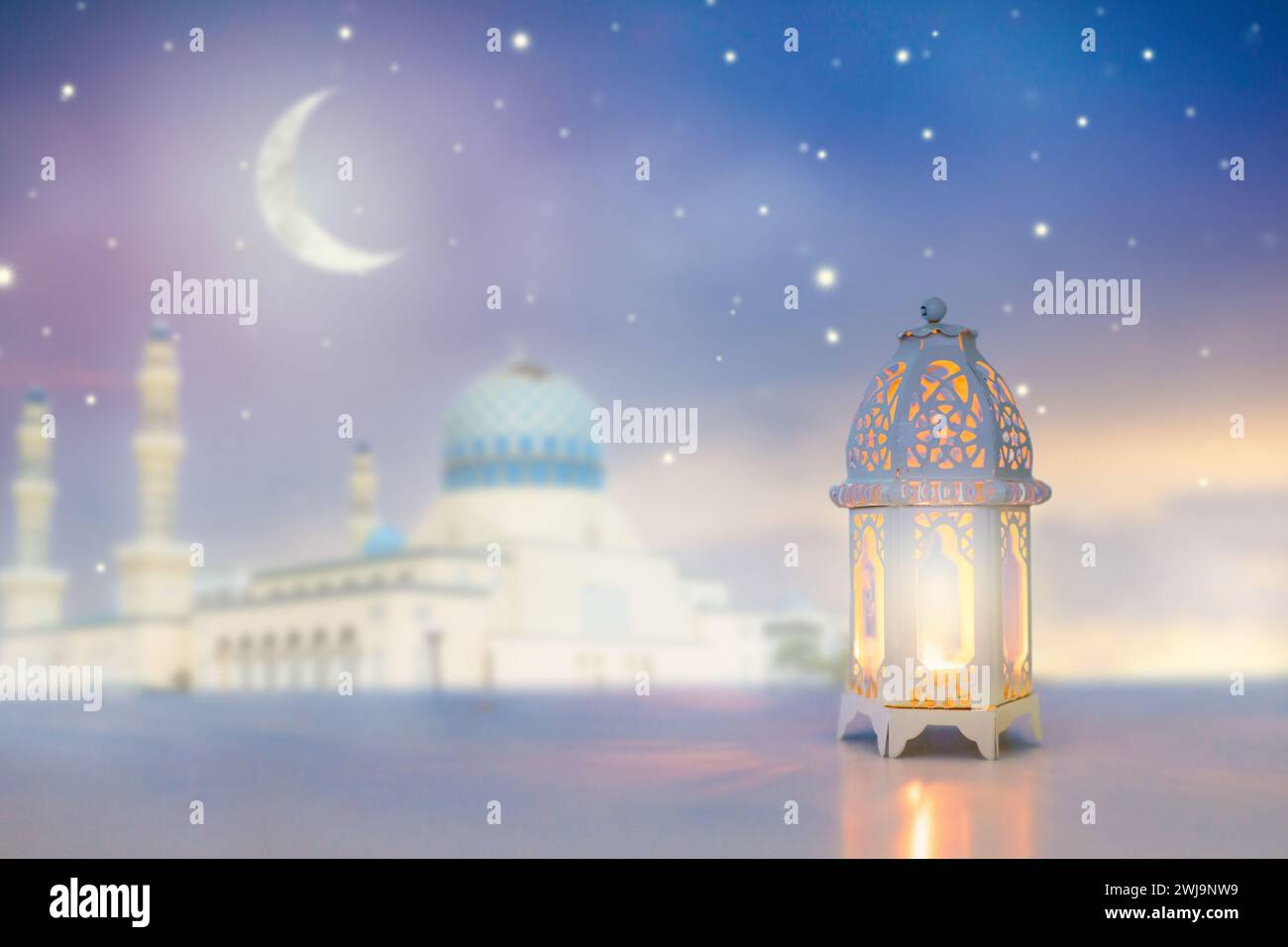 Ramadan Kareem greeting. Islamic lantern near mosque with night sky ...