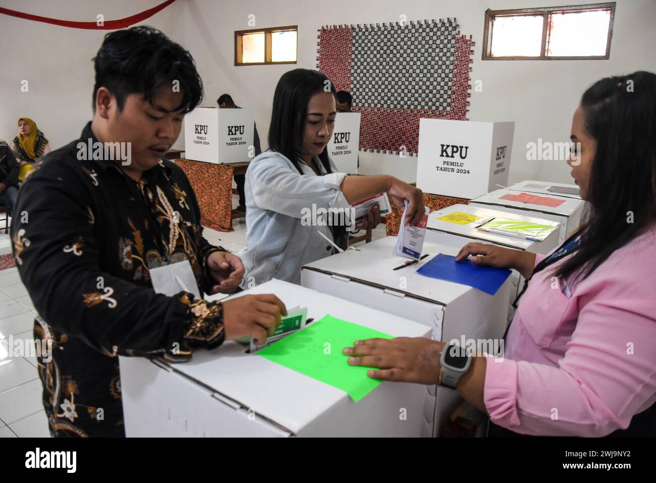 Bandung, West Java, Indonesia. 14th Feb, 2024. Residents put ballot ...