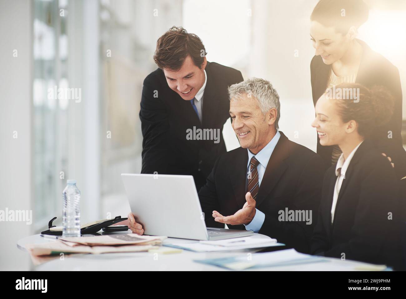 Employees, discussion and CEO with laptop in office, smile and ...