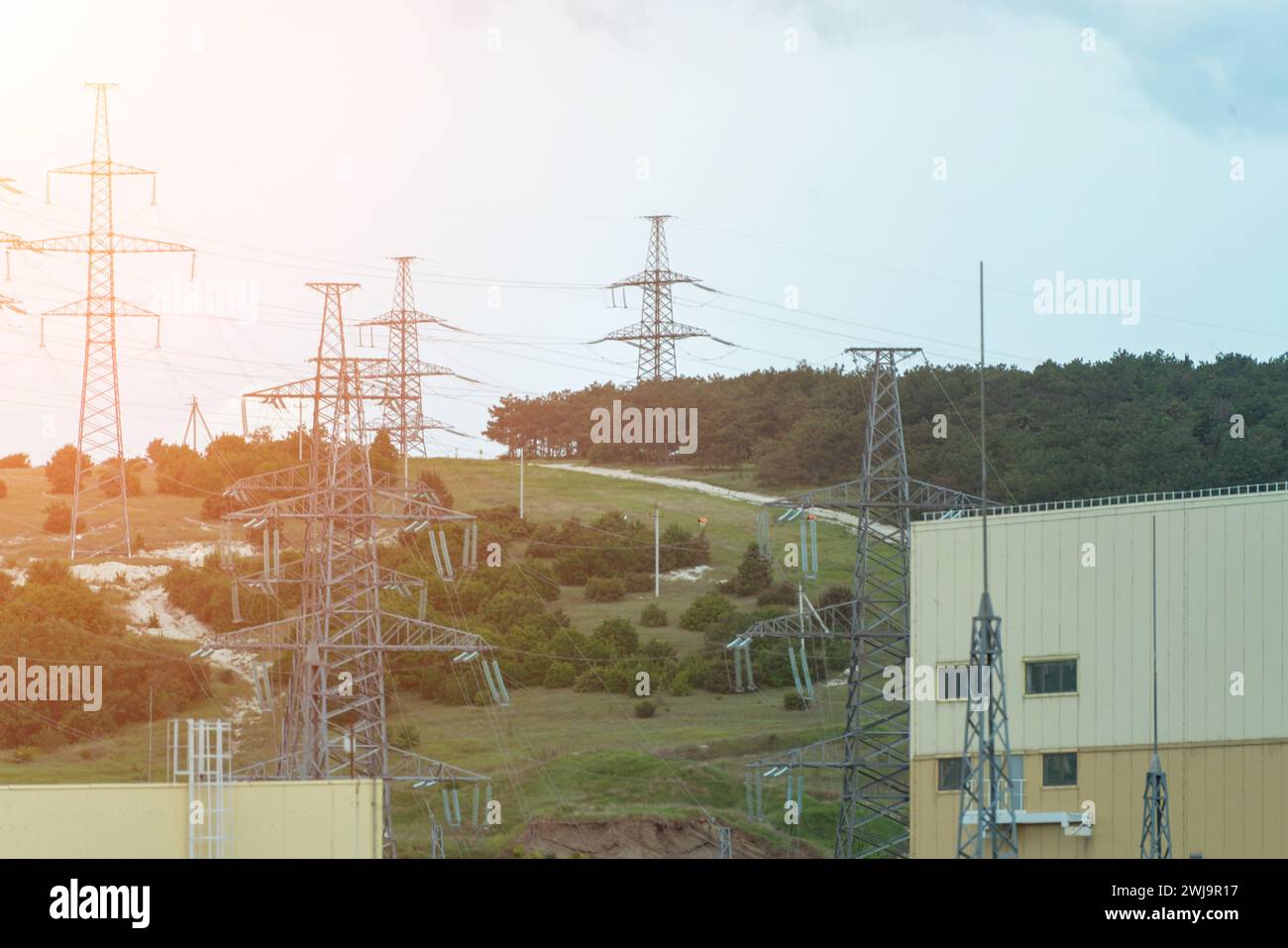 High voltage towers with sky background. Power line support with wires ...