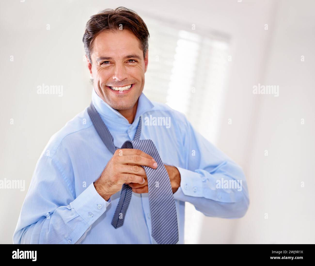 Portrait, tying tie and businessman dressing in home, job or ...