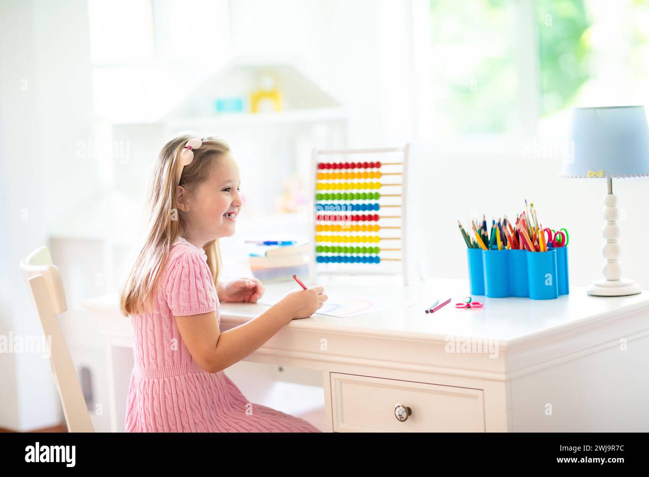 Child doing homework at home. Little kid with wooden colorful abacus ...