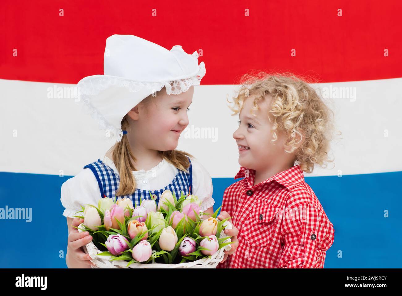 Little Dutch girl and boy wearing traditional national costume, dress ...