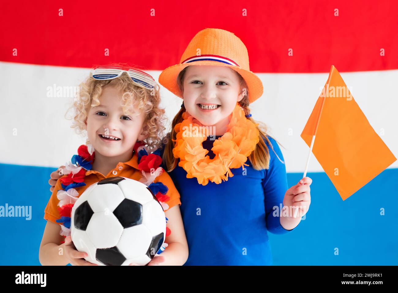 Children cheering and supporting Dutch football team. Kids fans and ...
